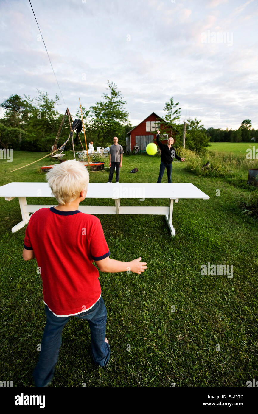 A boy playing in the garden with a ball Stock Photo - Alamy