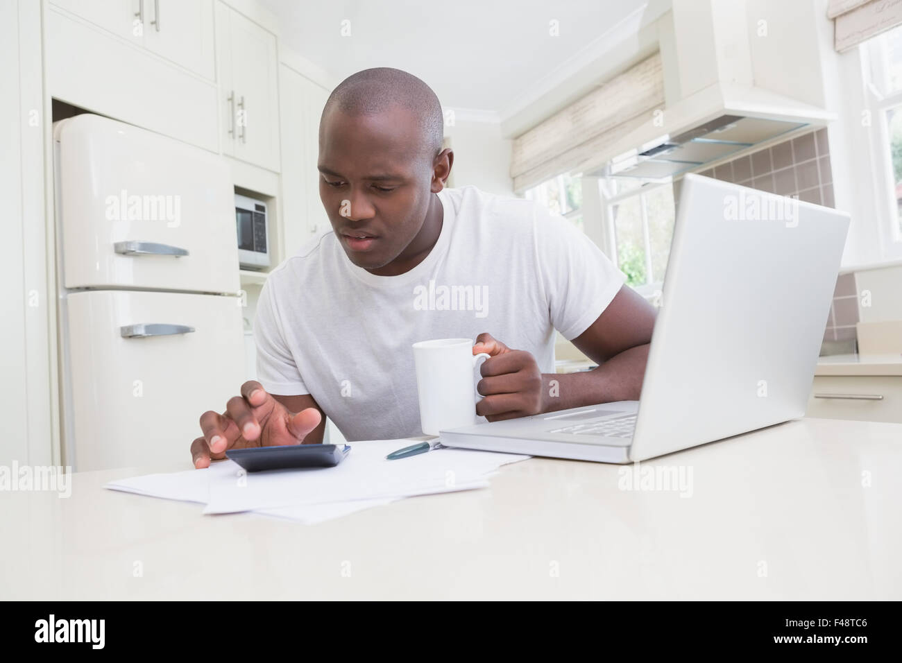 A man working and using his laptop Stock Photo - Alamy