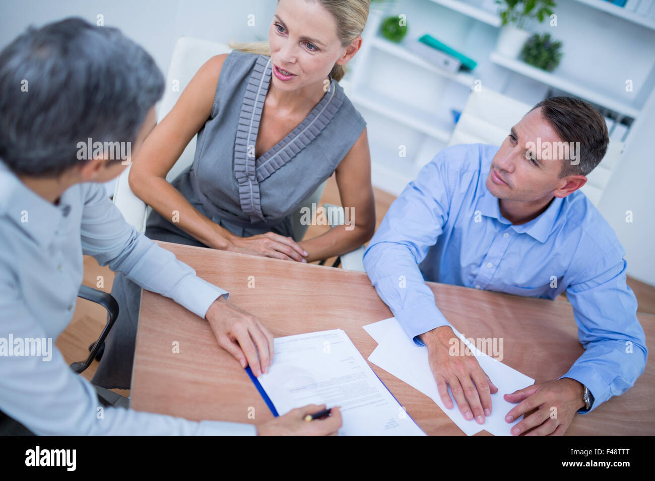 A business team brainstorming together Stock Photo - Alamy