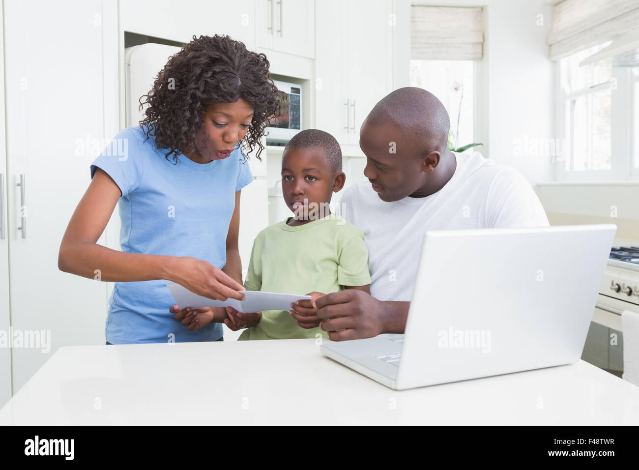 A family working and using his computer Stock Photo - Alamy