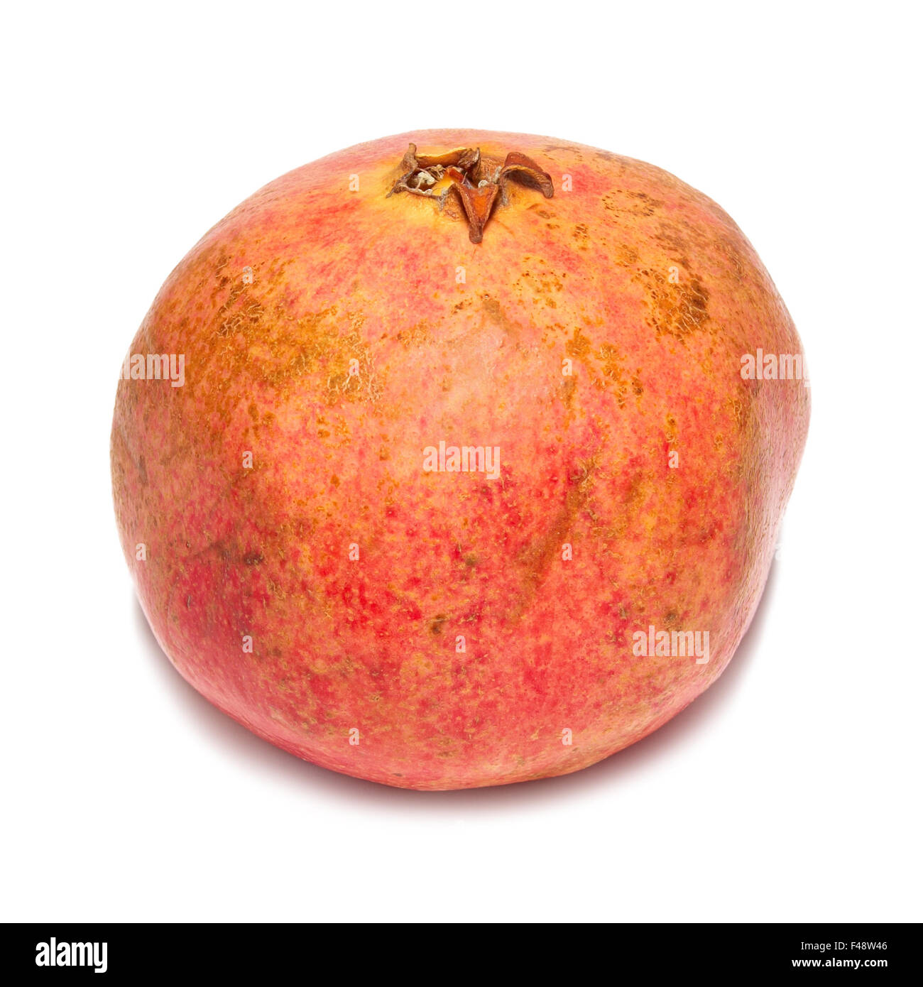 Ripe pomegranate isolated on white Stock Photo - Alamy