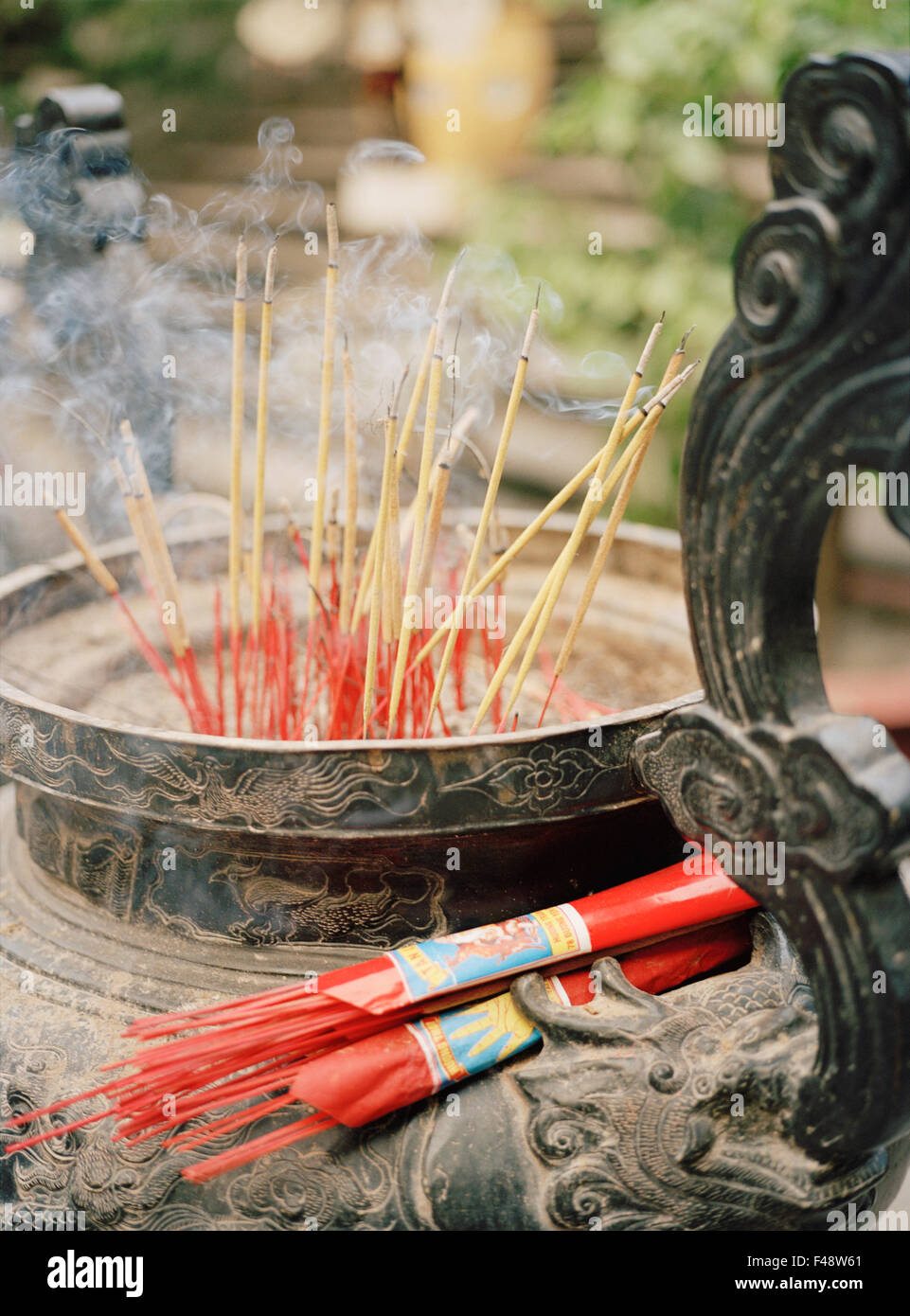 Incense in front of a temple Stock Photo - Alamy