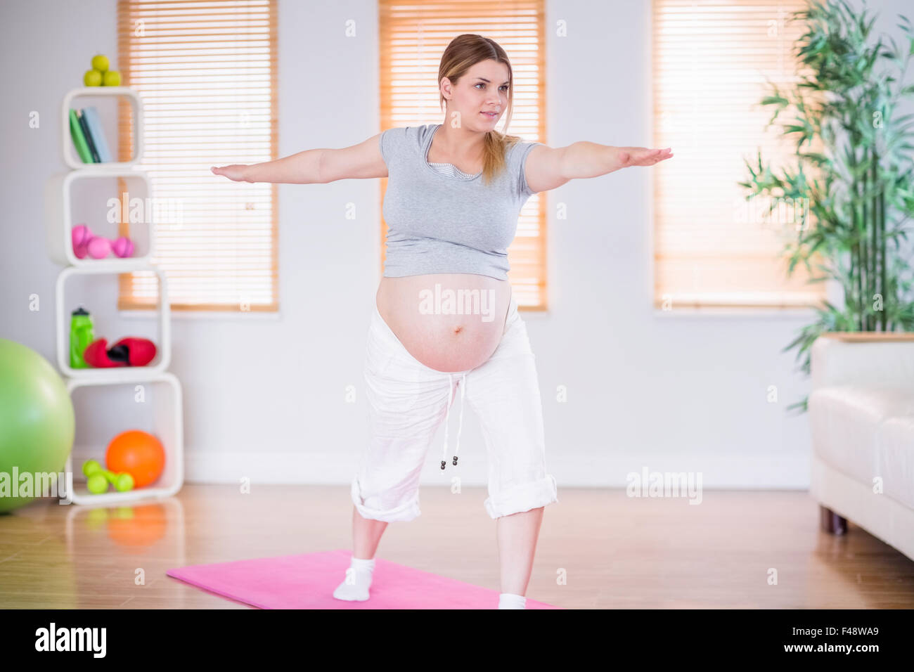 A pregnant woman doing exercise Stock Photo - Alamy