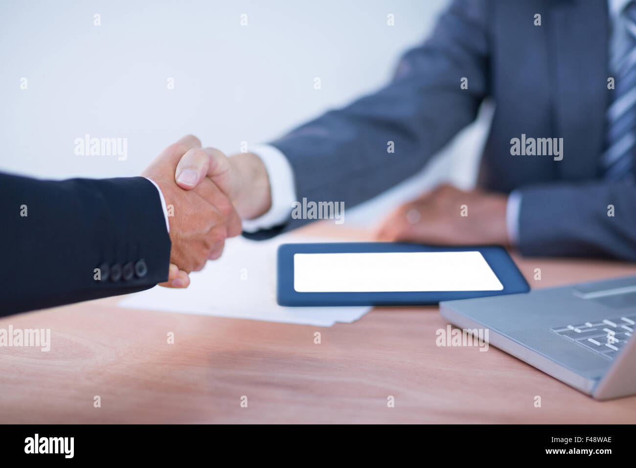 Two businessmen colleagues shaking hi-res stock photography and images ...
