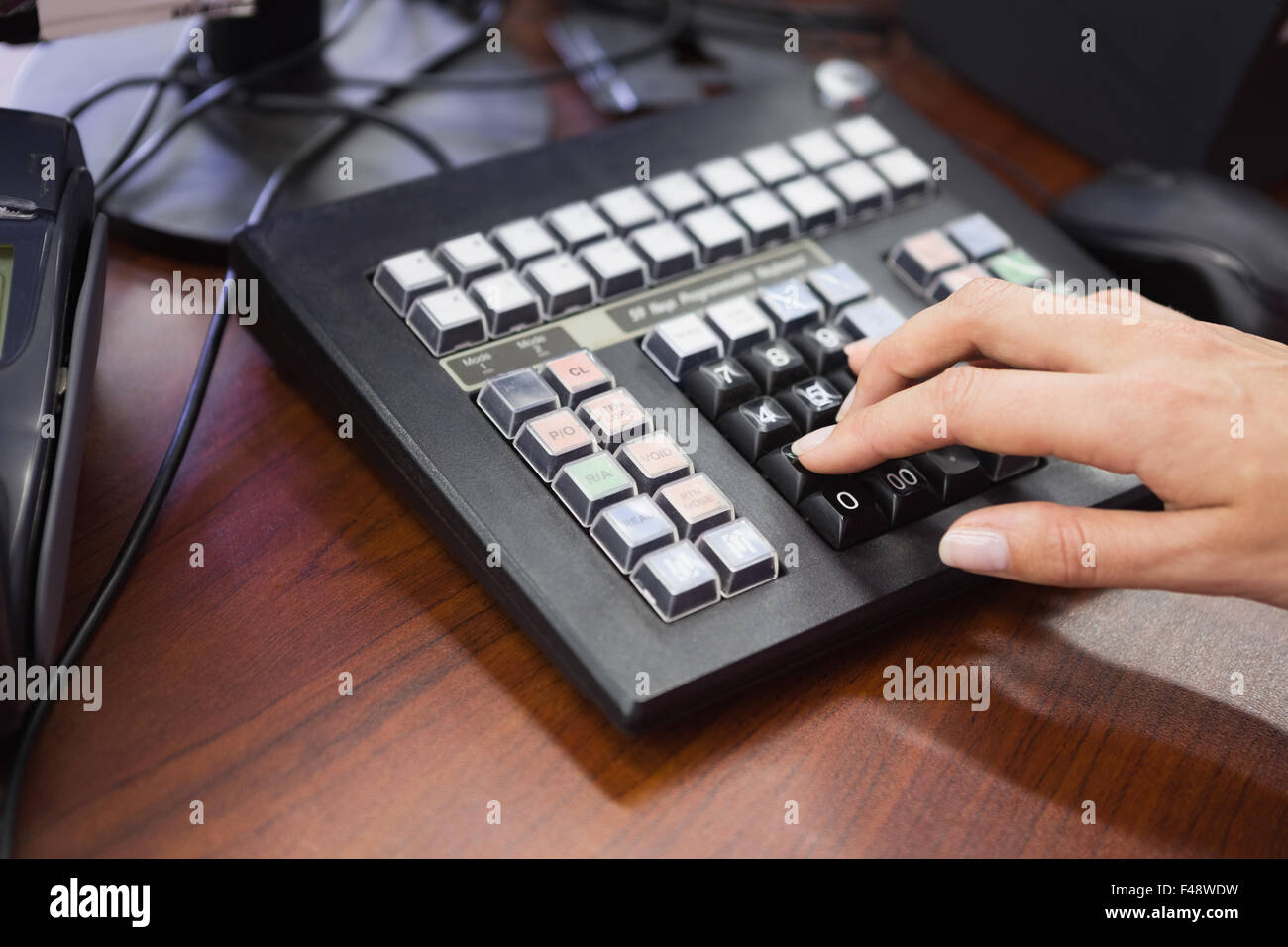 Close up view of woman using machine Stock Photo - Alamy