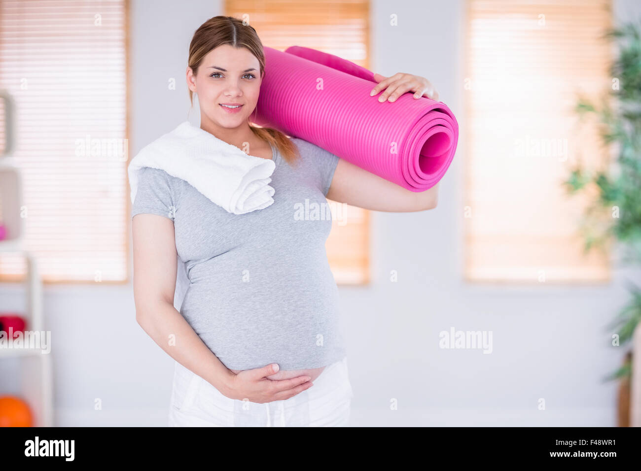 Pregnant woman keeping in shape Stock Photo - Alamy