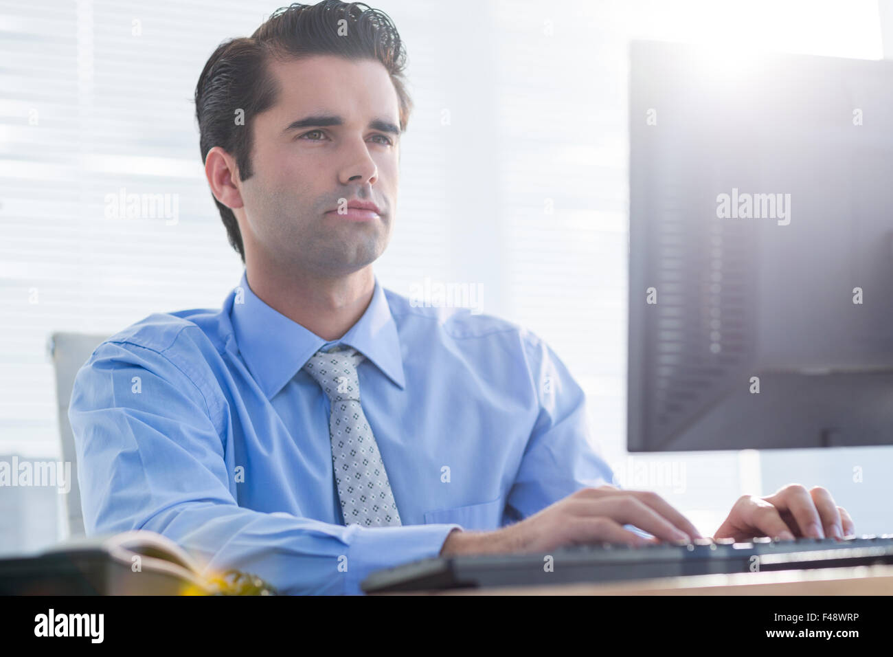Serious businessman using computer Stock Photo - Alamy