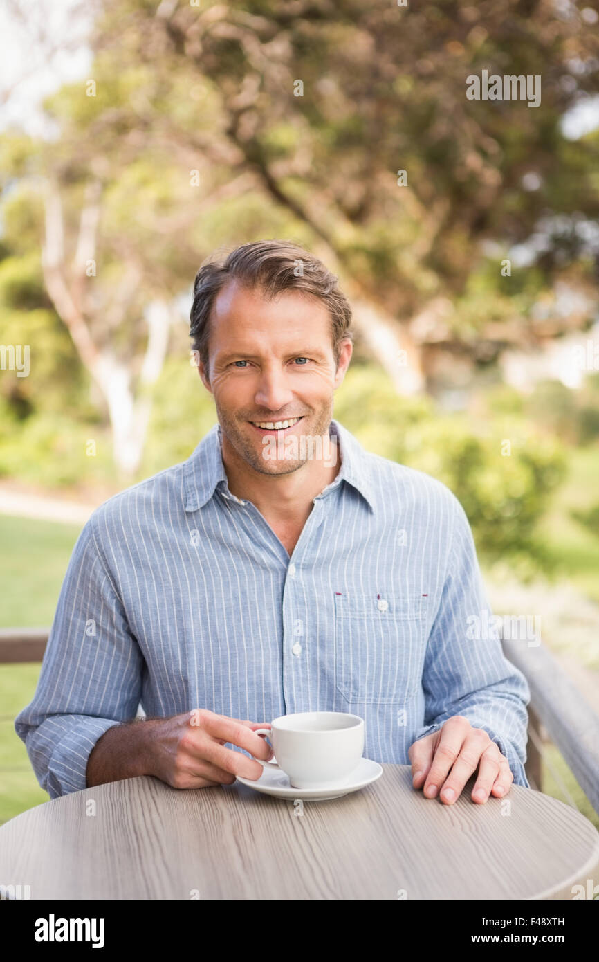 Portrait of a man drinking coffee outdoors Stock Photo - Alamy