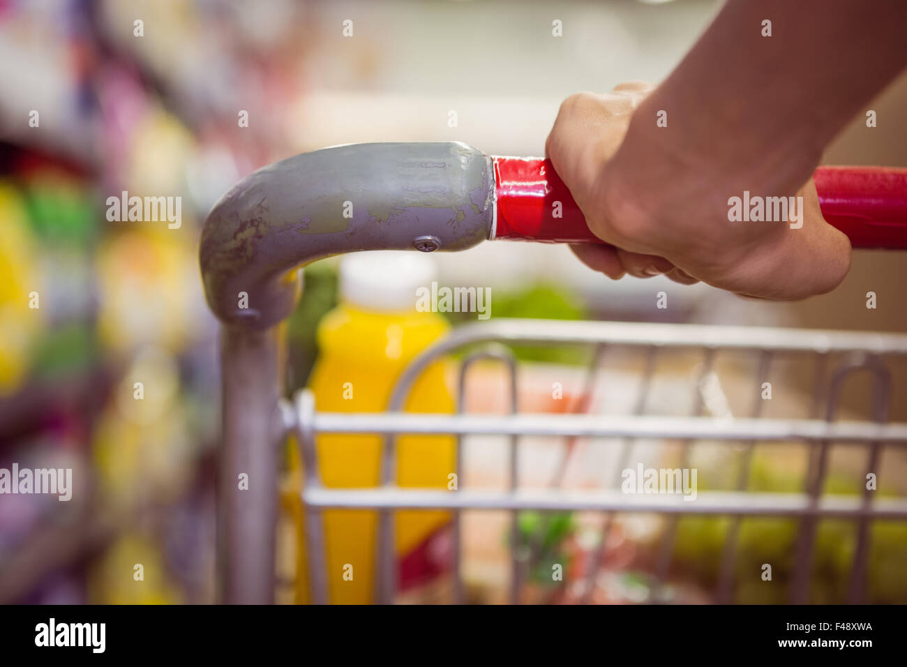 Woman buy products trolley hi-res stock photography and images - Alamy
