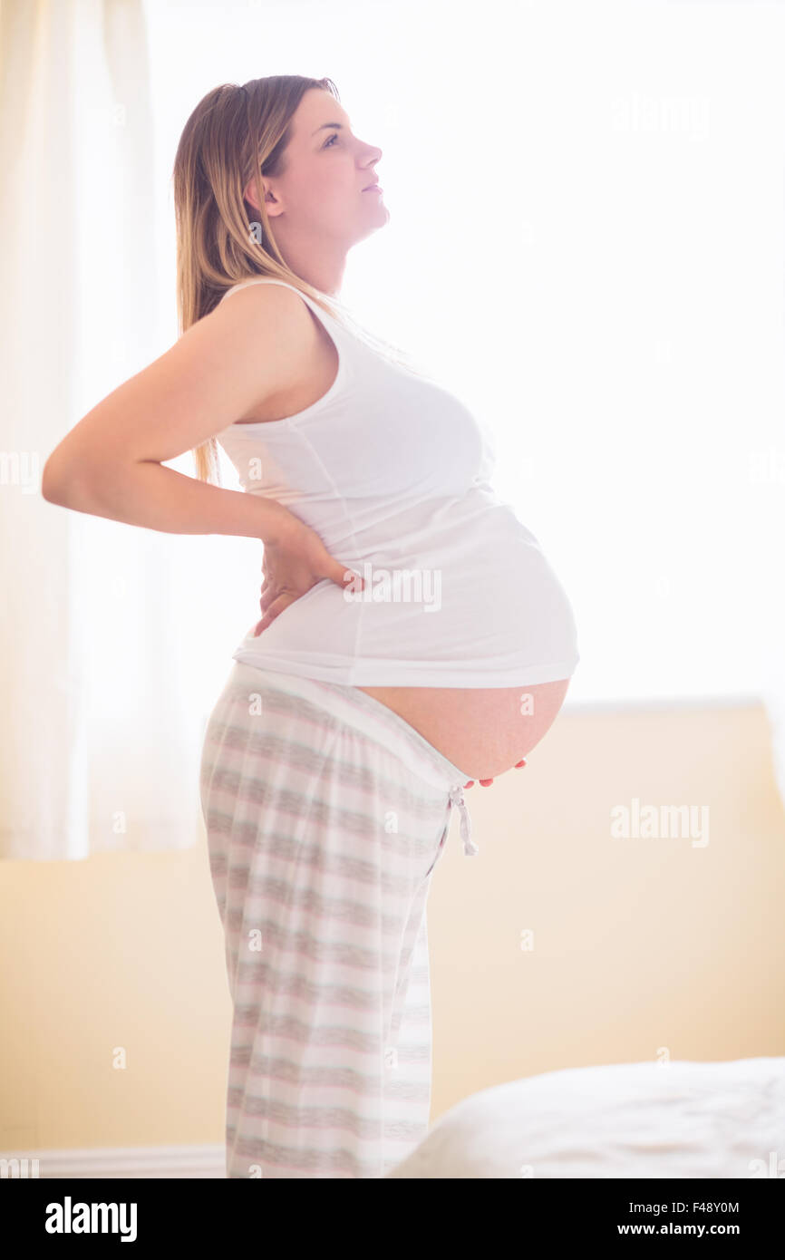 Thoughtful pregnant woman looking away Stock Photo - Alamy