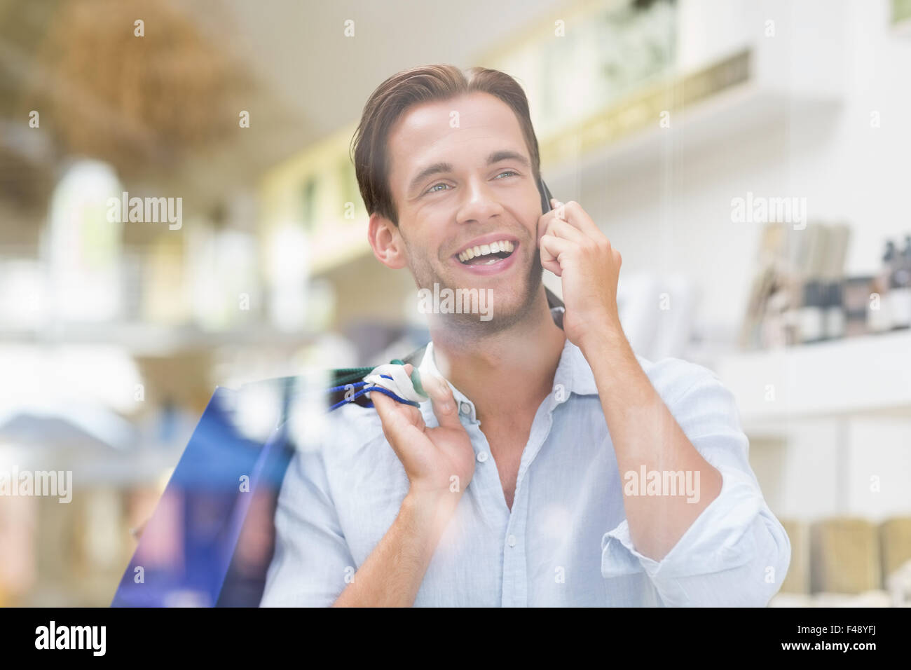 A happy smiling man calling Stock Photo - Alamy