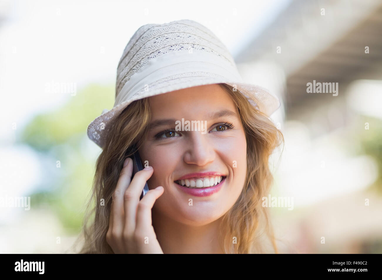 Pretty smiling woman on the phone Stock Photo - Alamy