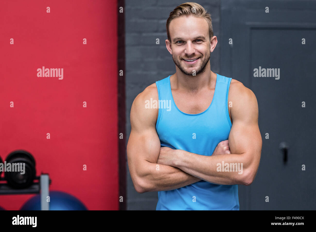Muscular man with crossed arms Stock Photo - Alamy