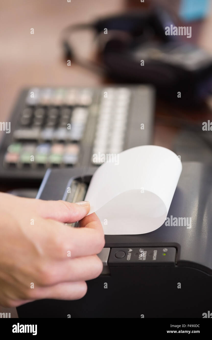 Hand of woman taking receipt Stock Photo - Alamy