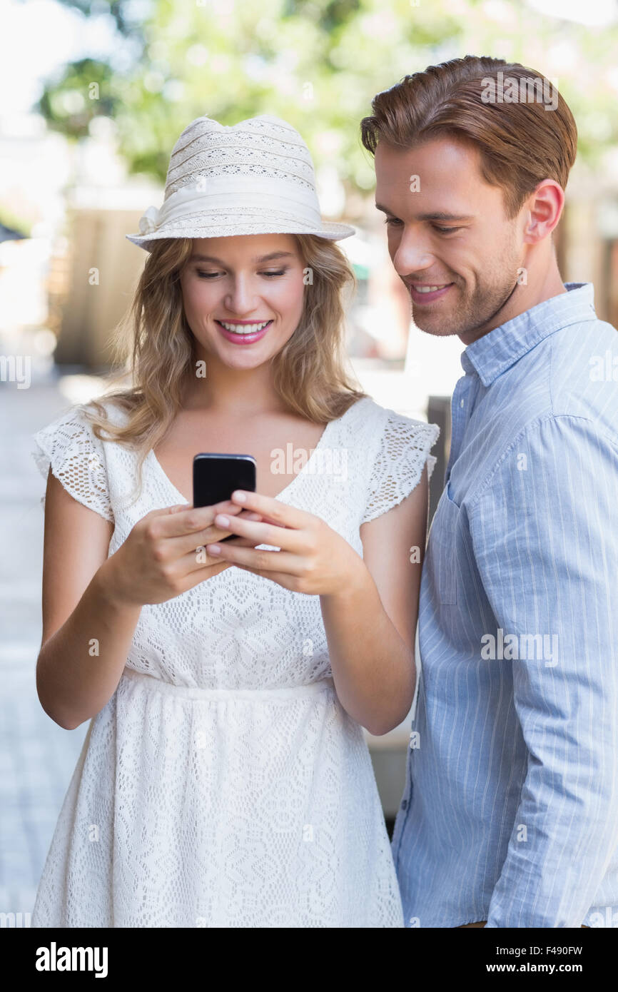 Couple sending message smartphone hi-res stock photography and images ...