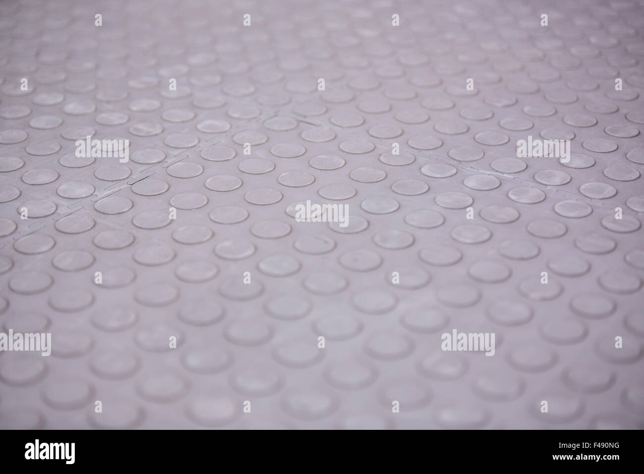 Grey coloured heavy grip ground Stock Photo - Alamy