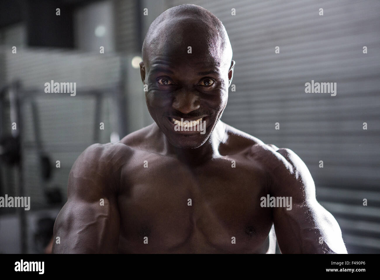 Young Bodybuilder smiling at the camera Stock Photo - Alamy