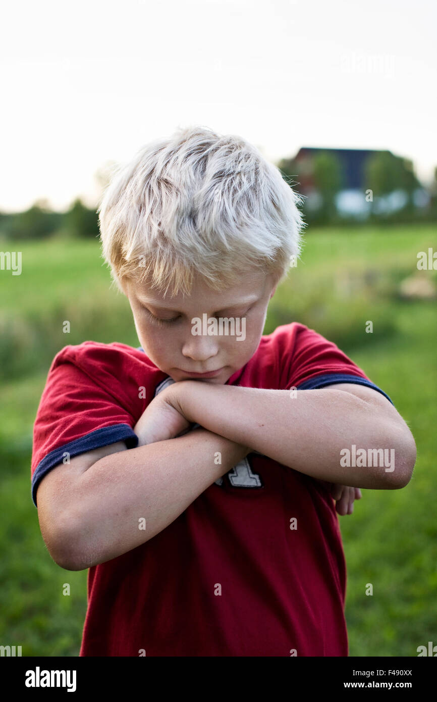 A grumpy boy Stock Photo - Alamy