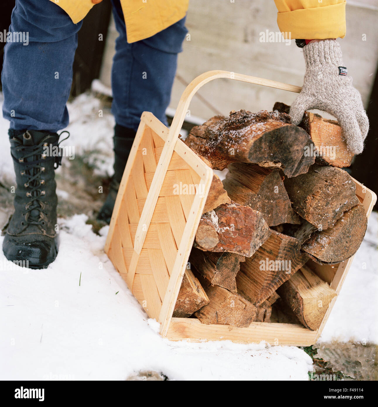 Woman stacking wood, Sweden Stock Photo - Alamy