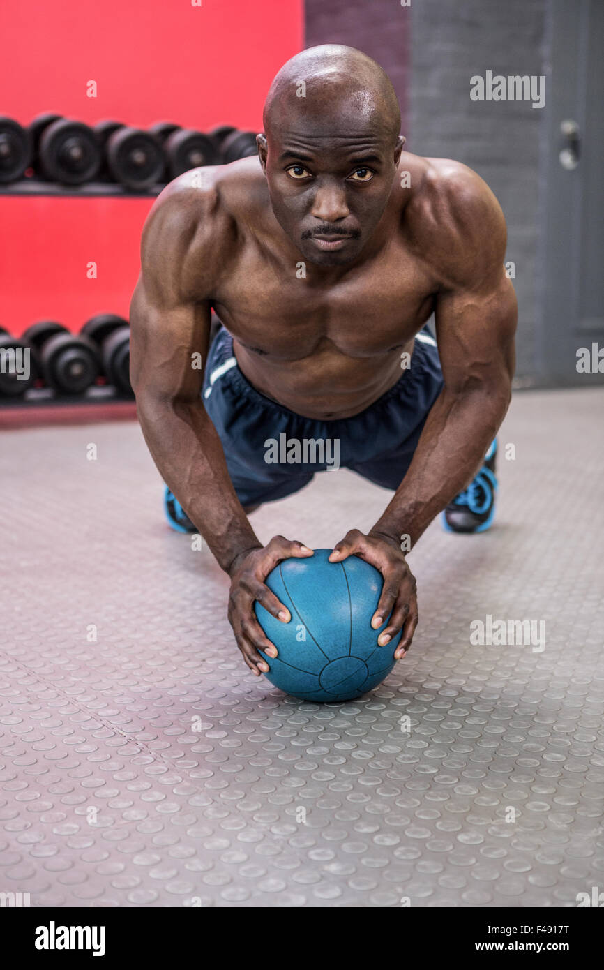 Young bodybuilder doing excercises Stock Photo - Alamy
