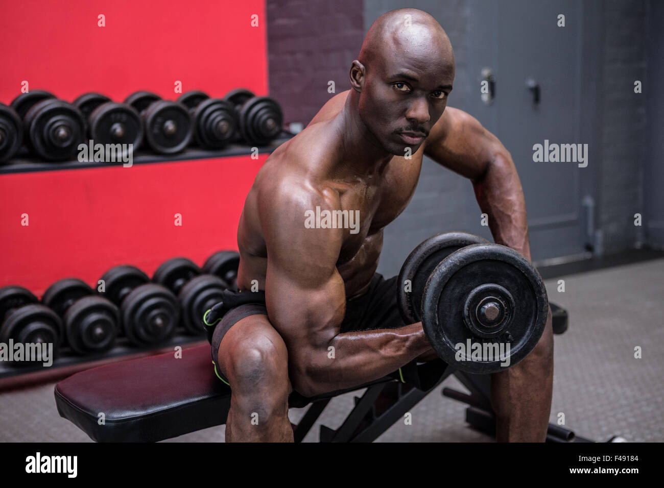 Young Bodybuilder doing weightlifting Stock Photo - Alamy