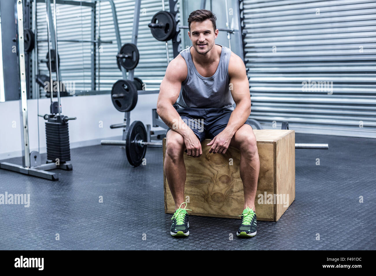 Smiling muscular man looking at the camera Stock Photo - Alamy
