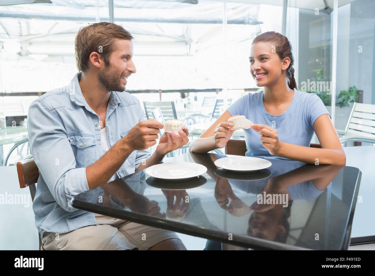 Happy young couple eating cake hi-res stock photography and images - Alamy