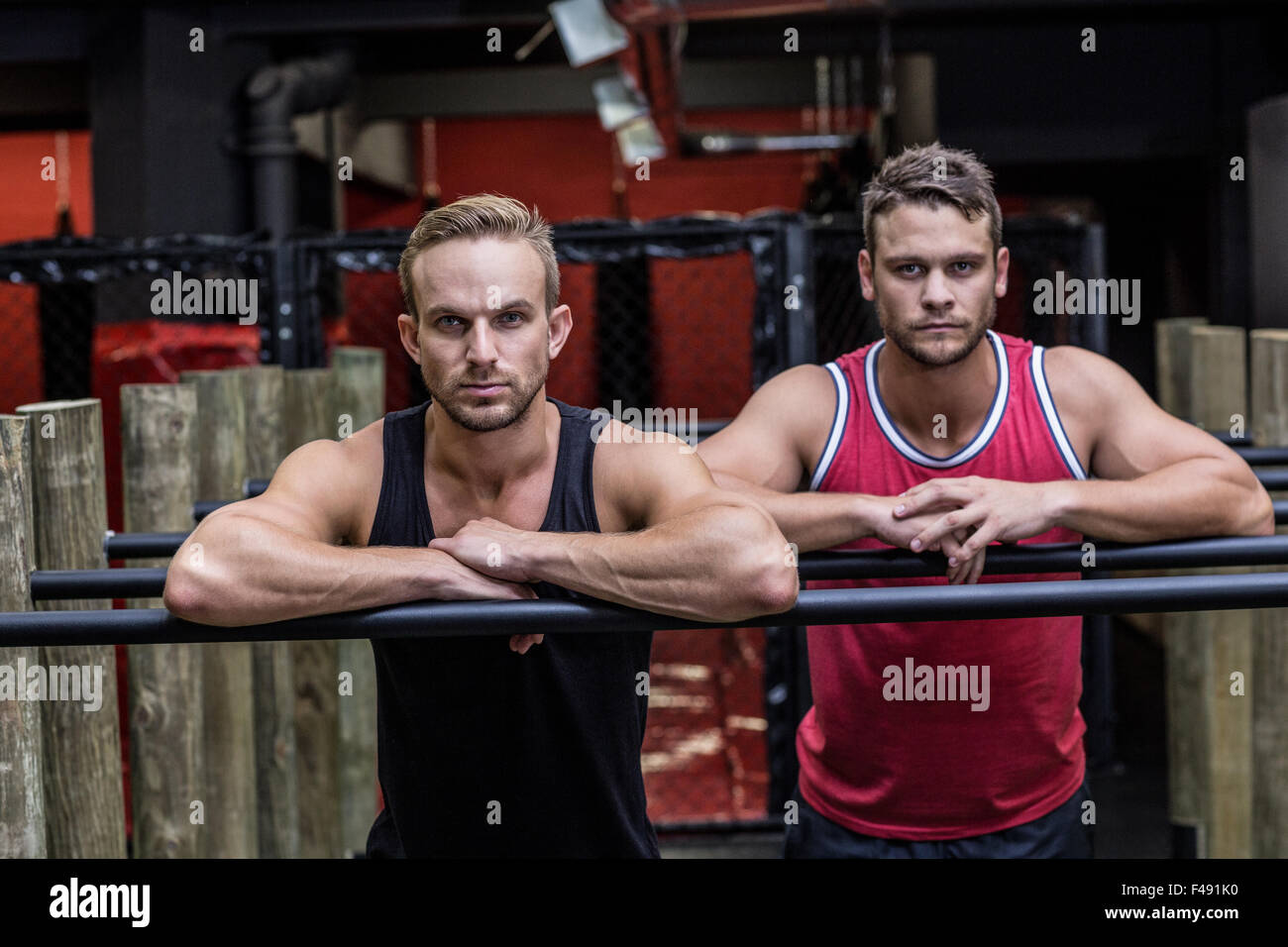 Two muscular men looking at camera Stock Photo - Alamy