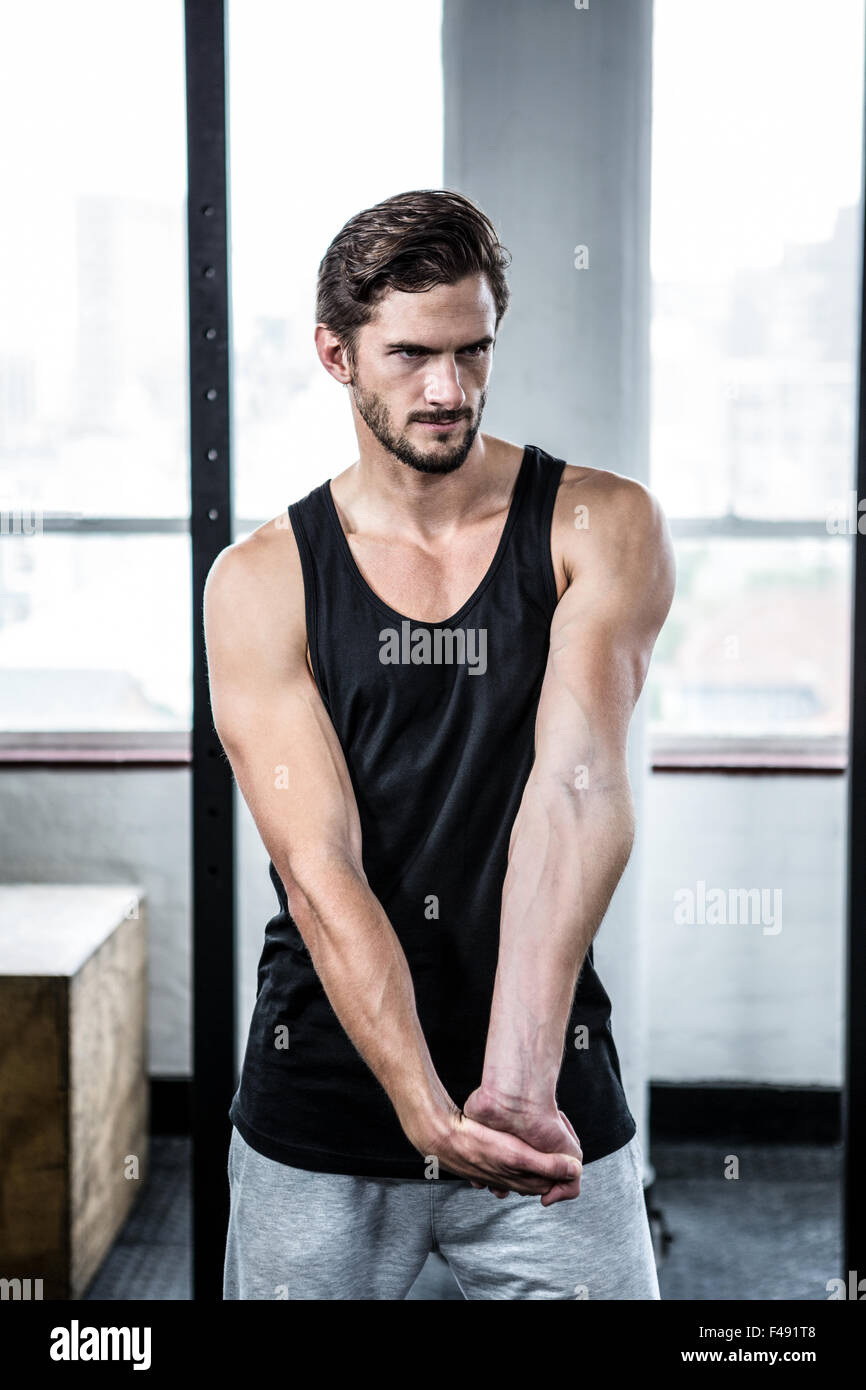 Fit man stretching his arms Stock Photo - Alamy