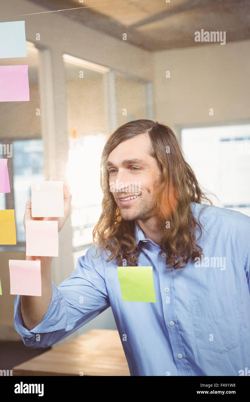 Creative businessman writing on sticky notes Stock Photo - Alamy