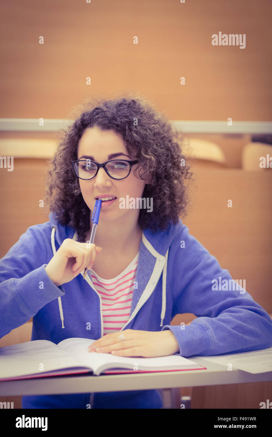 Focused student taking notes in lecture Stock Photo - Alamy
