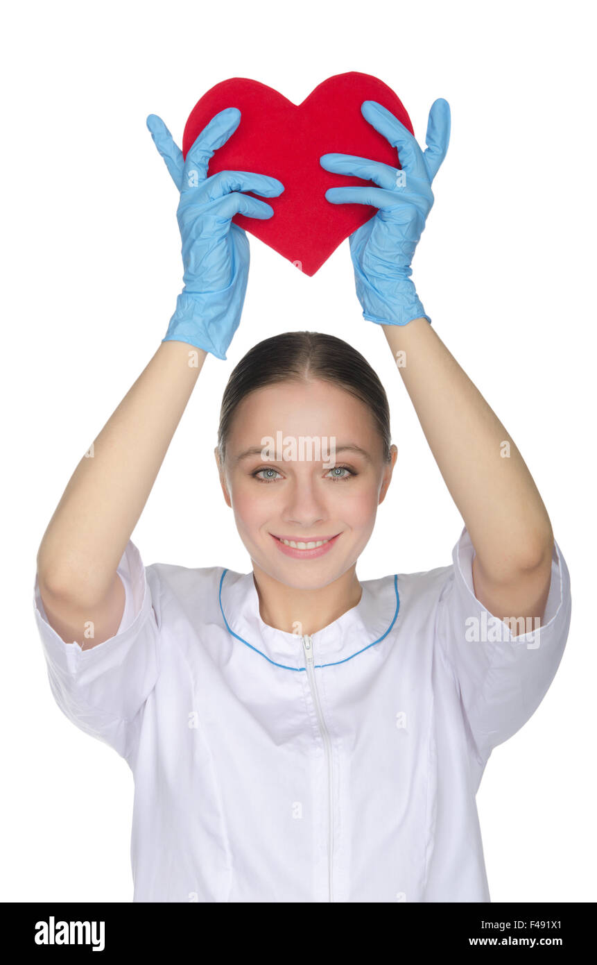 Female doctor held up a heart symbol Stock Photo - Alamy