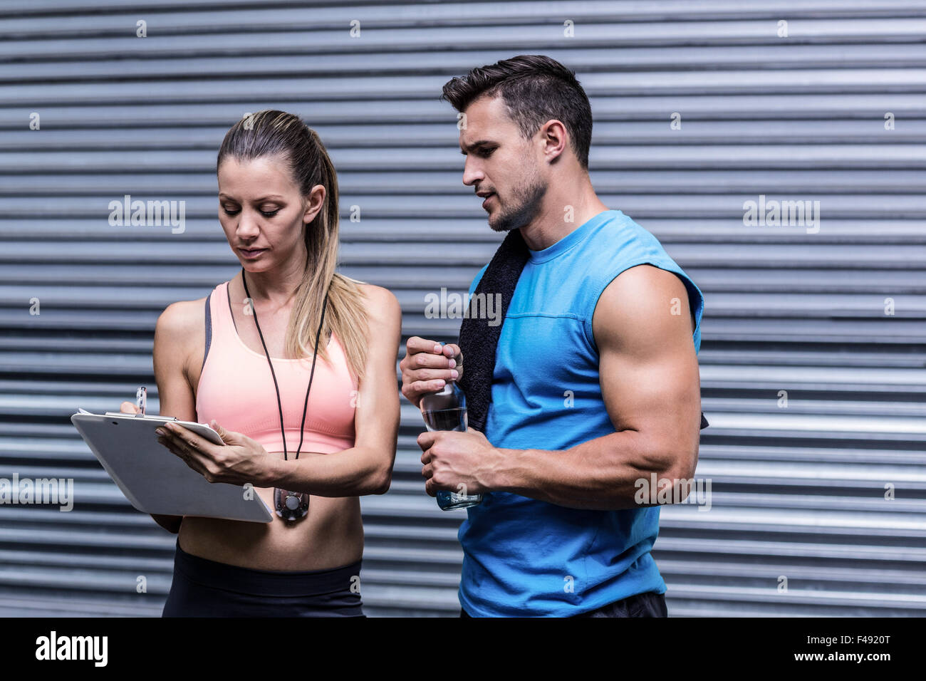 Male fitness coach talking female hi-res stock photography and images ...