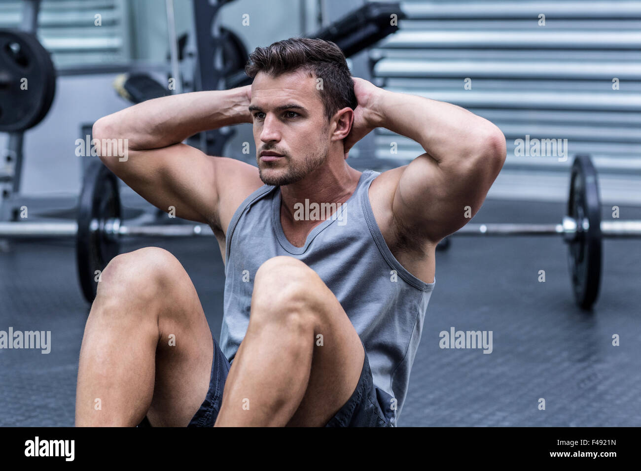 Muscular man doing abdominal crunch Stock Photo - Alamy
