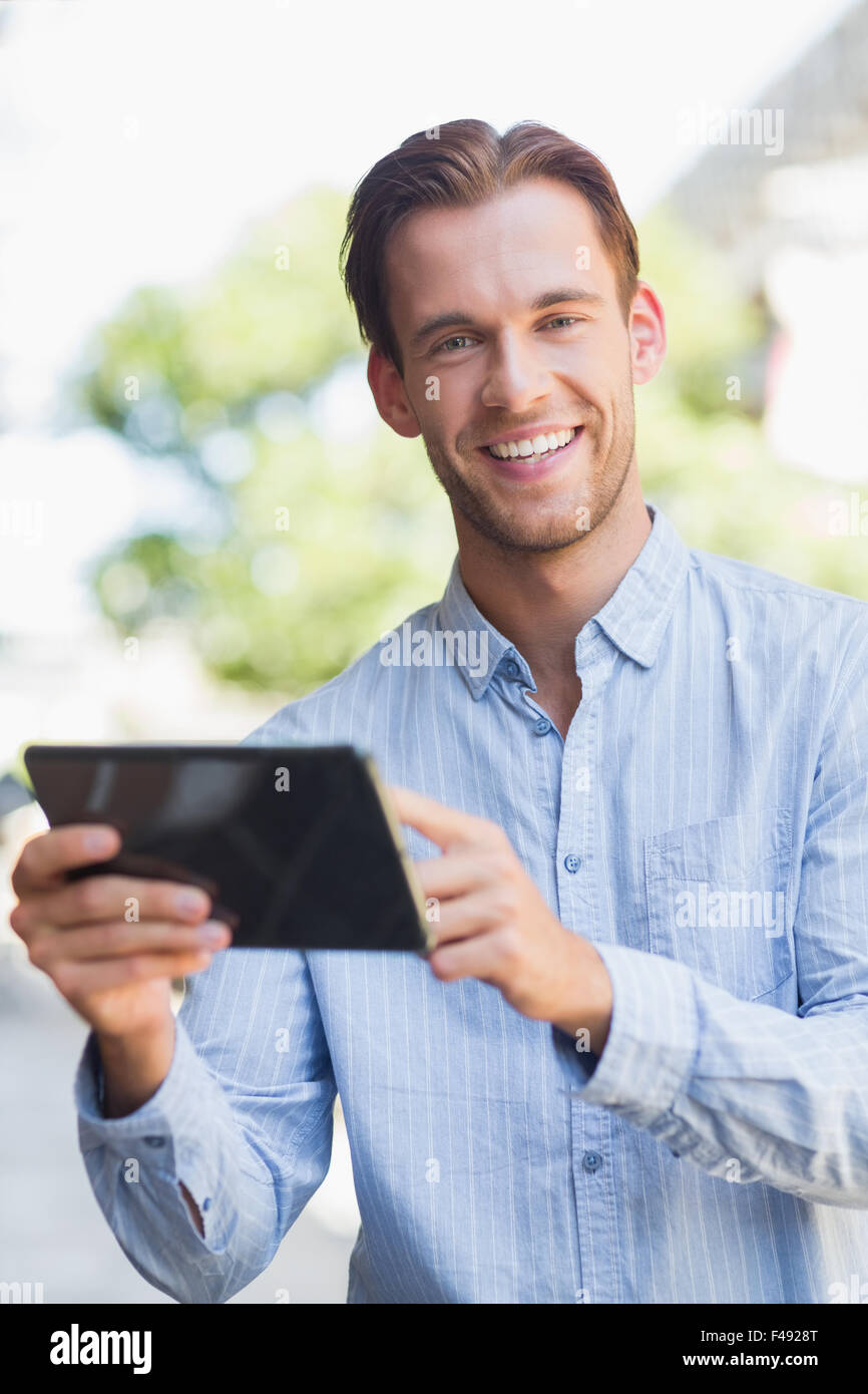 Handsome man looking at the camera Stock Photo - Alamy