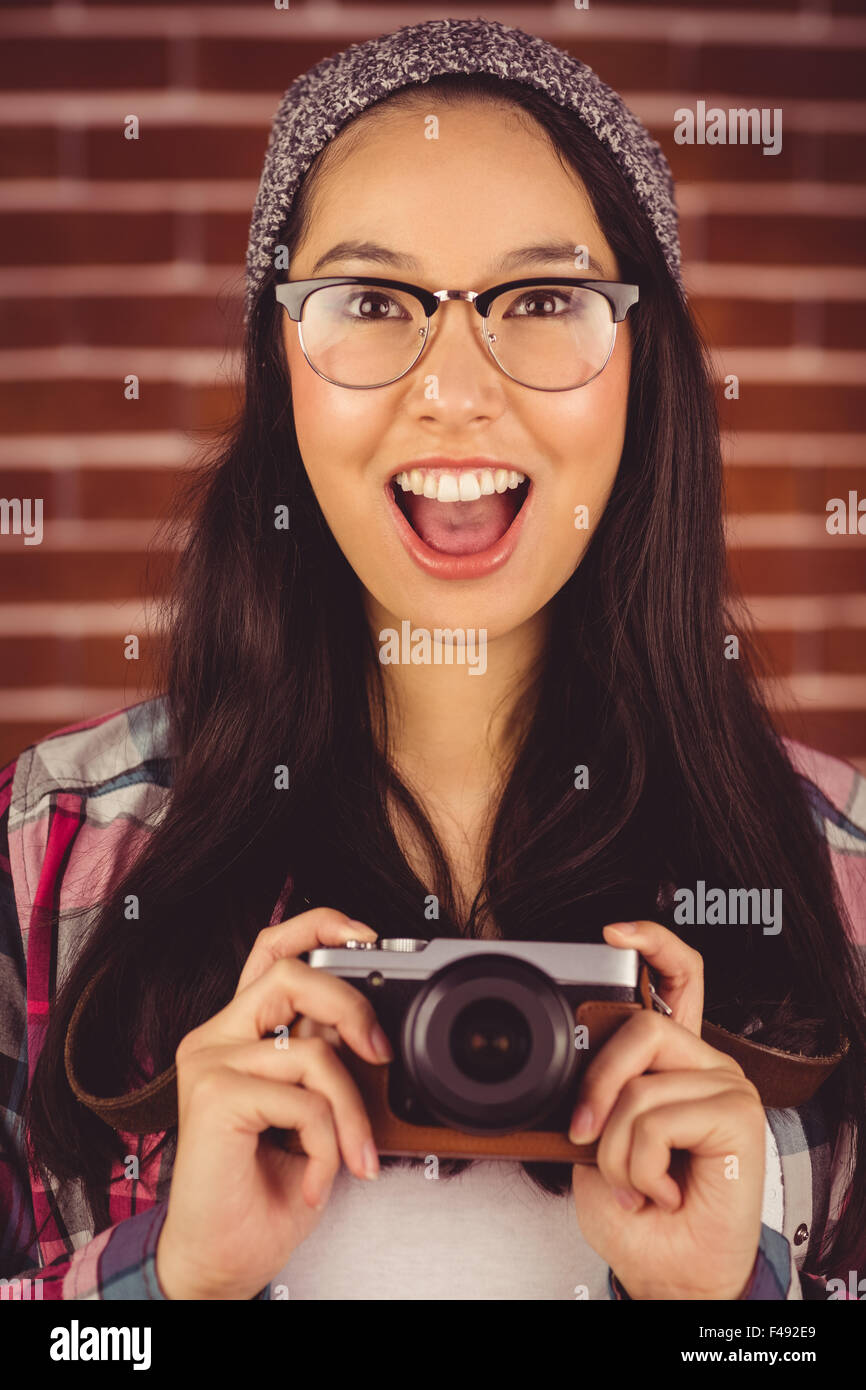Attractive hipster photographing with camera Stock Photo - Alamy