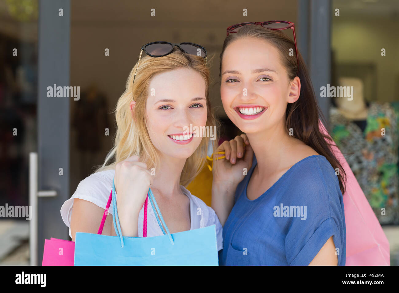 Happy smiling friends looking at the camera Stock Photo - Alamy
