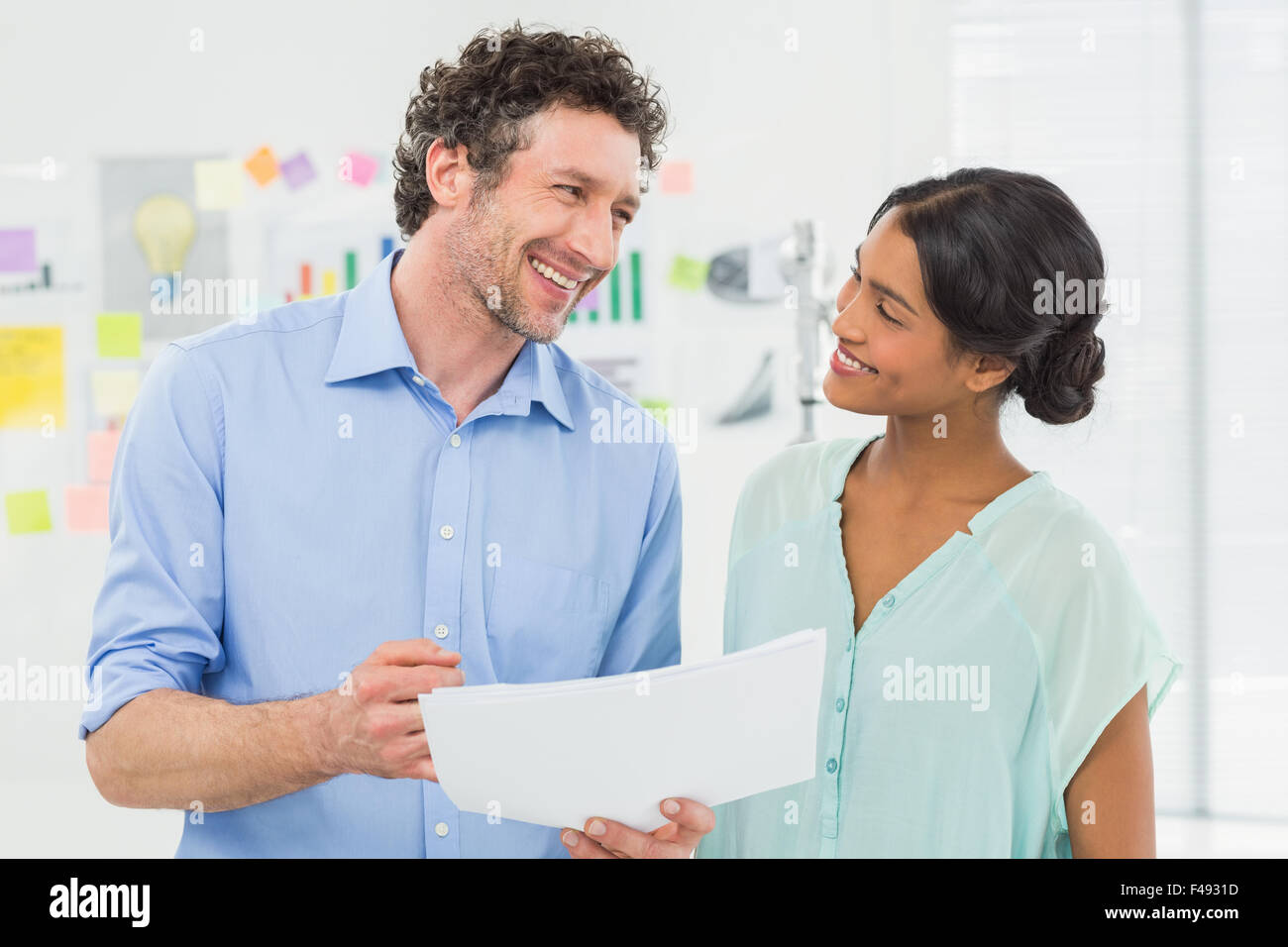 Two creative business people laughing Stock Photo - Alamy