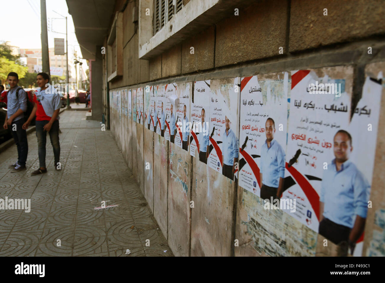 Minya, Egypt. 15th Oct, 2015. Posters of a candidate for the upcoming ...