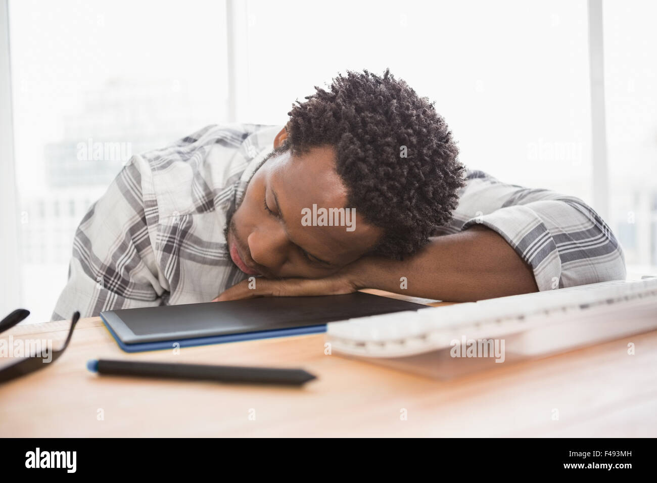 Businessman sleeping on desk hi-res stock photography and images - Alamy