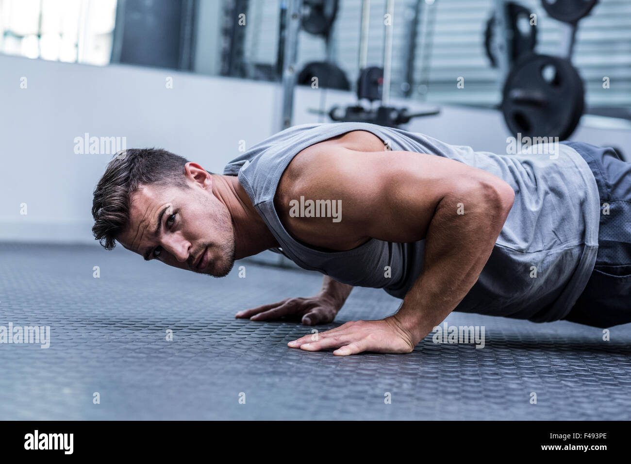 A muscular man doing a pushups Stock Photo - Alamy