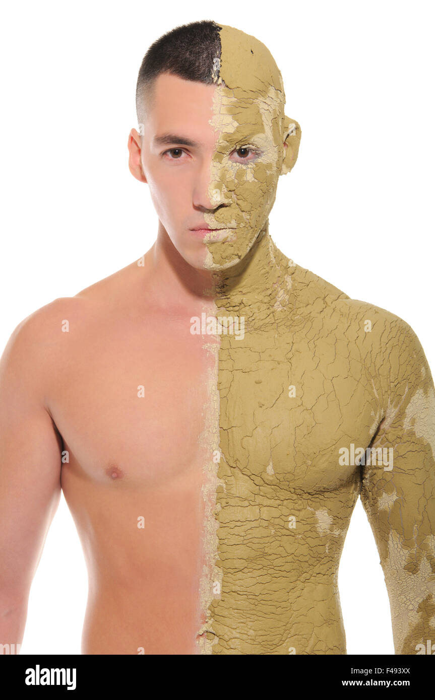 young man half smeared with clay Stock Photo - Alamy