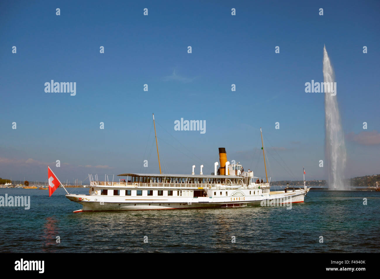 Ship with Swiss flag and Jet d Eau fountain on Geneva Lake, Geneva ...