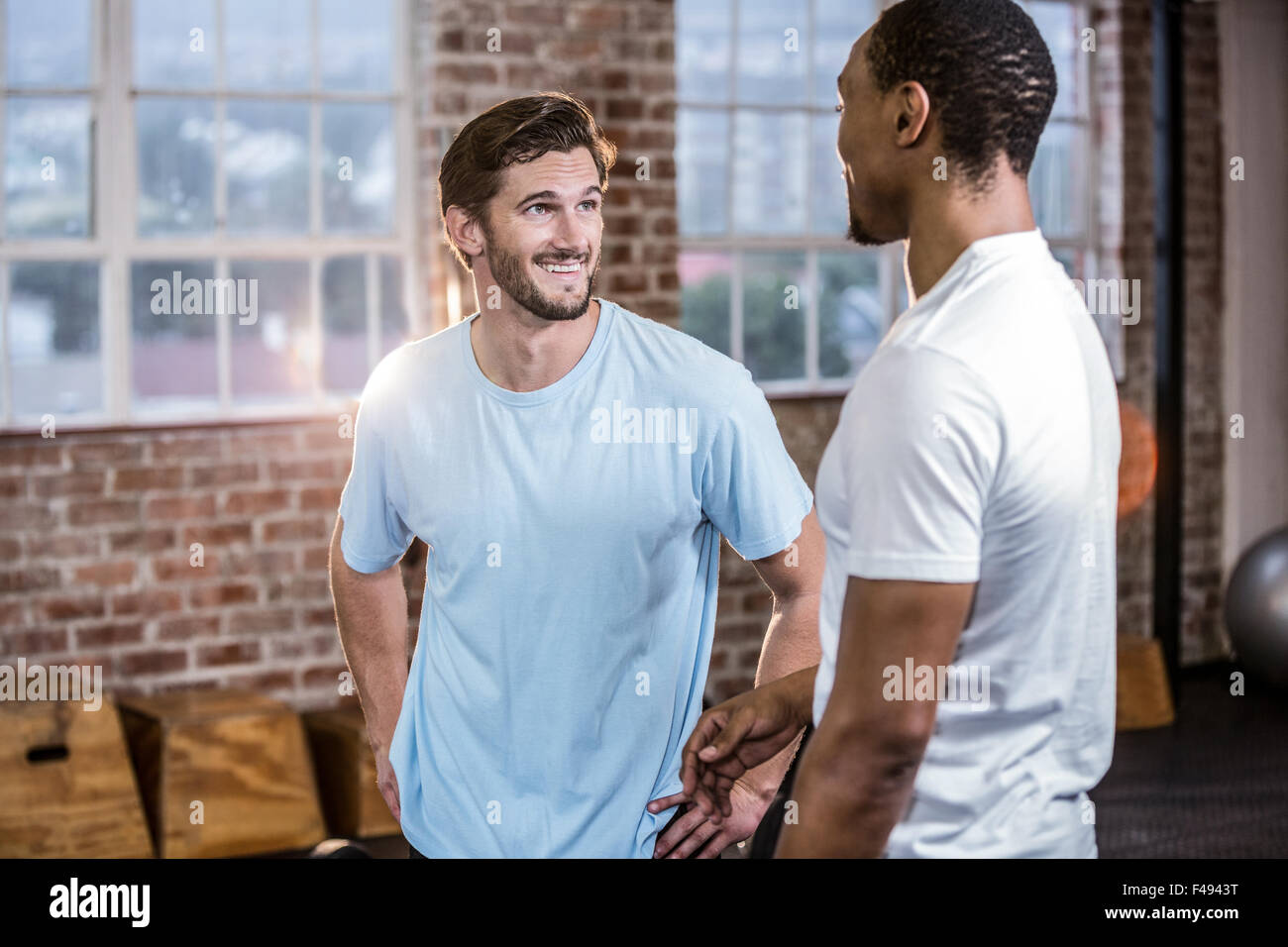Fit people smiling in the studio Stock Photo - Alamy