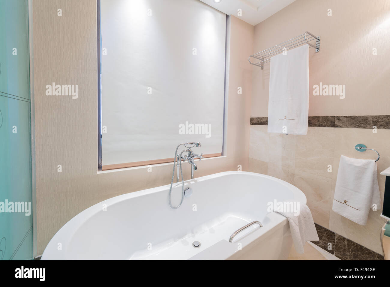 Modern bathroom interior with bathtub Stock Photo - Alamy