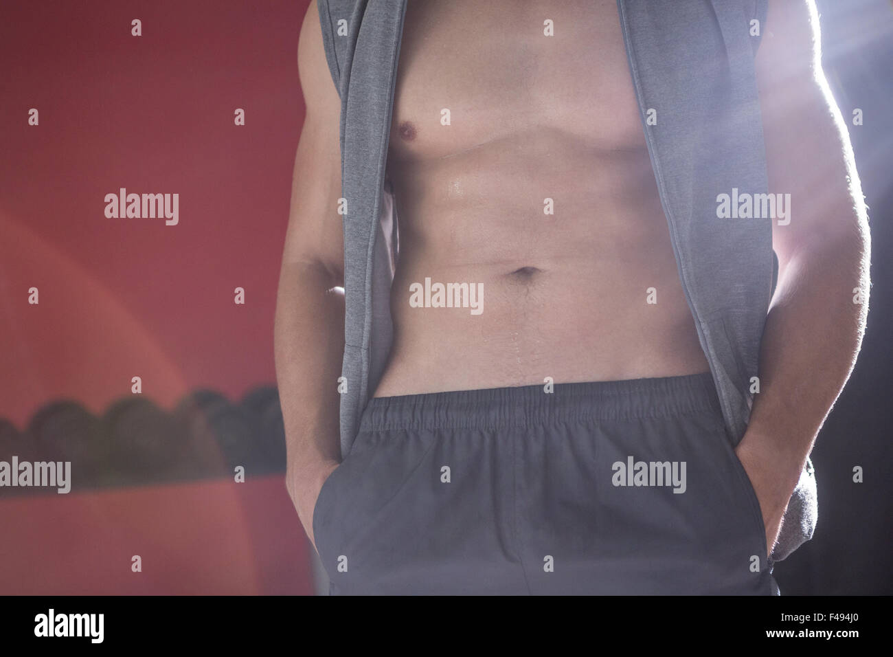 Muscular man with hands in his pocket Stock Photo - Alamy