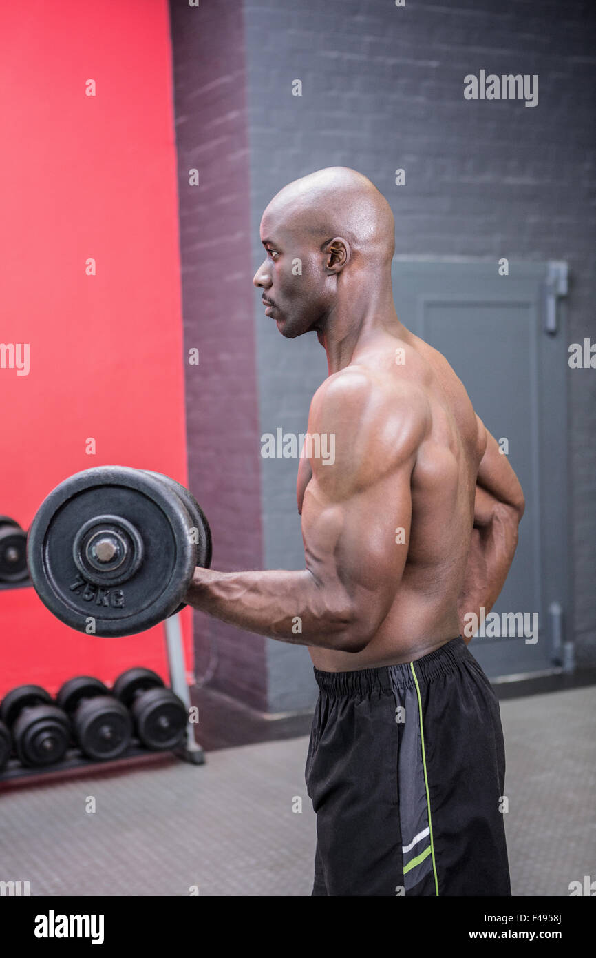 Young Bodybuilder doing weightlifting Stock Photo - Alamy