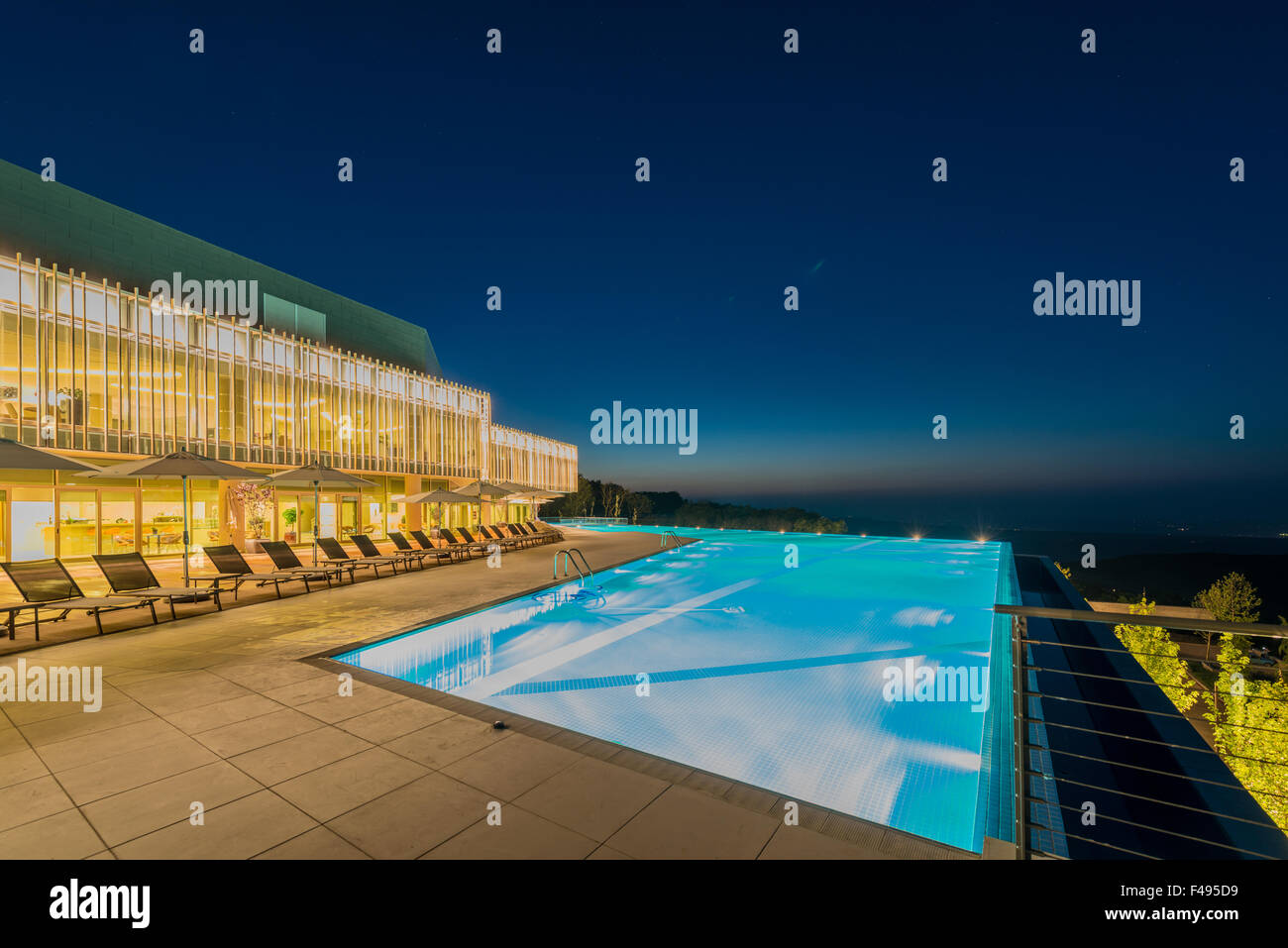 Swimming pool at night time Stock Photo - Alamy