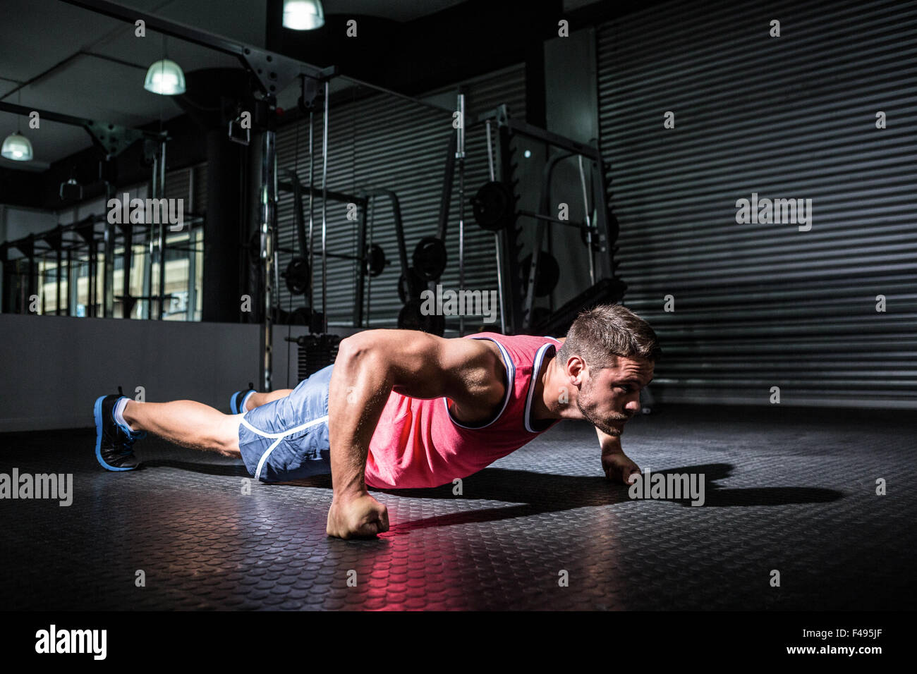 Muscular man doing push-ups Stock Photo - Alamy