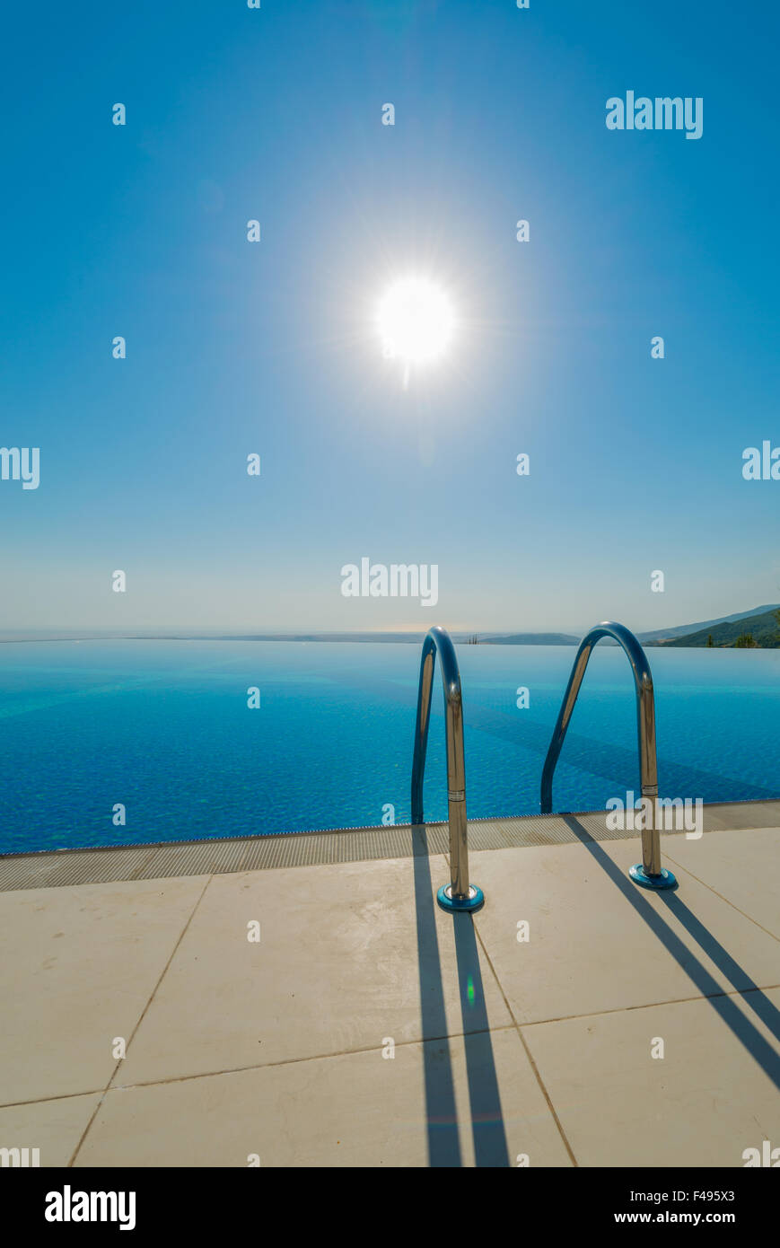 Infinity pool on the bright summer day Stock Photo - Alamy
